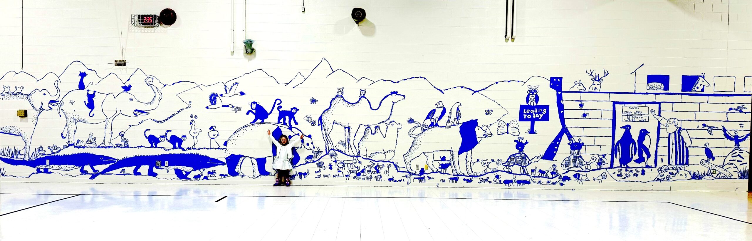 St. Joseph Catholic School unveils its 2025 gigantic blue tape mural ...